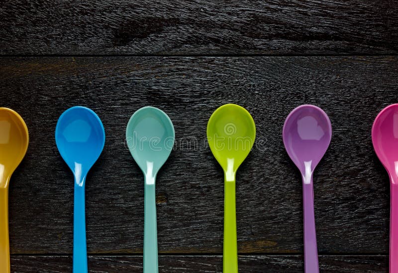 Top View Colorful Plastic Spoon on Wood Table Background with Co Stock ...