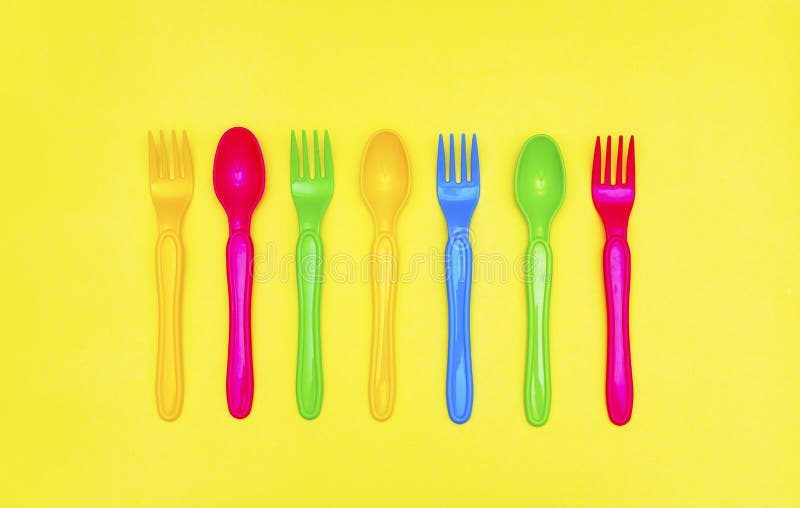 Top View of Colorful Spoon and Fork Element on Yellow Color Table.flat ...