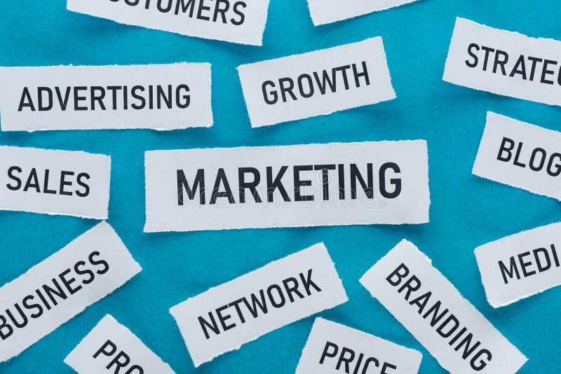 Top View of Components of Marketing on Pieces of Paper on Blue . Stock ...