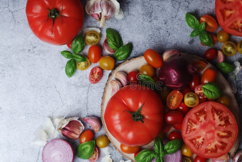 Composition of Different Tomatoes, Onion, Basil and Garlic Stock Photo ...