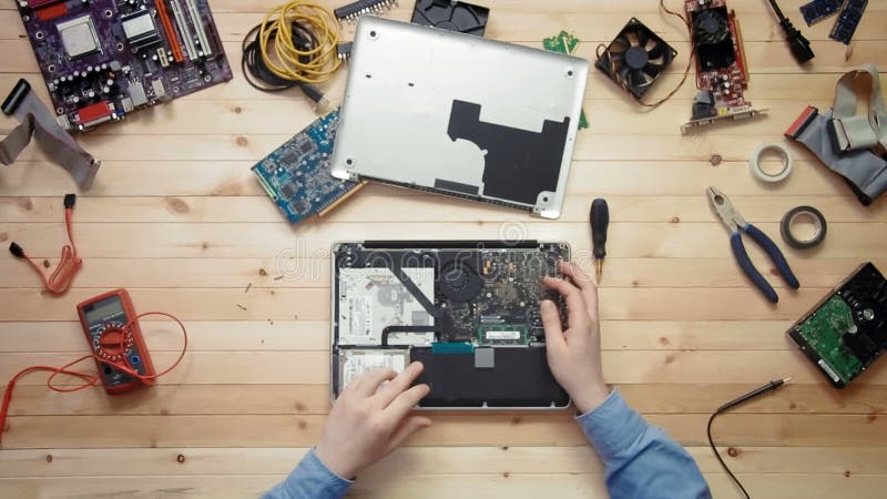 Top View Computer Technician Opens Broken Laptop Computer and Repairs ...