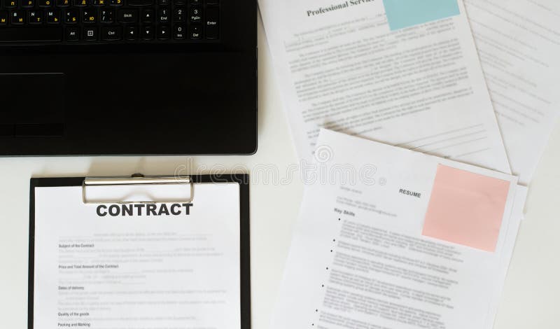 Top View of Contract in Clipboard Lying at Office on Table with Laptop ...