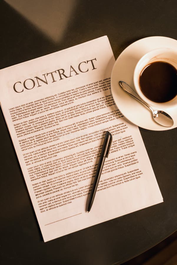 Top View of Contract and Cup of Coffee on Dark Tabletop Stock Photo ...