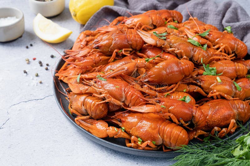 Top View of Cooked Crawfish Platter with Lemons and Spices on Cement ...
