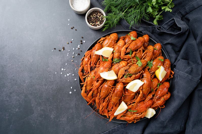 Top View of Cooked Crawfish Platter with Lemons and Spices on Cement ...
