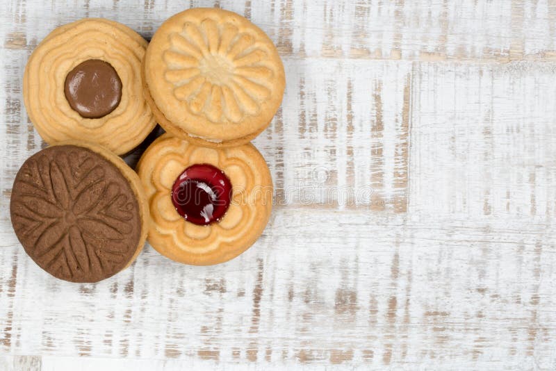 Top View of 4 Cookies at the Left Side on a Bright Wooden Table Stock ...
