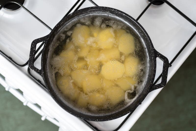 Top View Of Cooking Potato In A Pot With Boiling Water On A Gas Stove