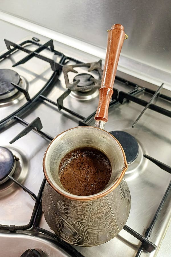 Top View of Copper Coffee Pot with Freshly Brewed Coffee on Gas Stove ...