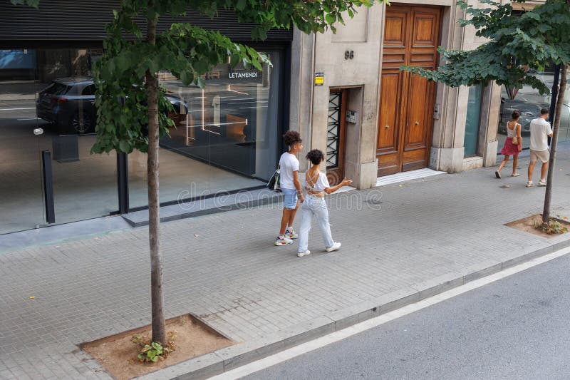 Top View of a Couple Walking on the Sidewalk through the Streets of ...