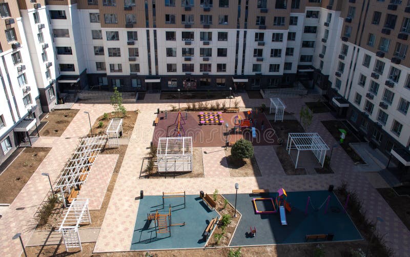 Top View of the Courtyard of a Multi-storey Building with a Playground ...