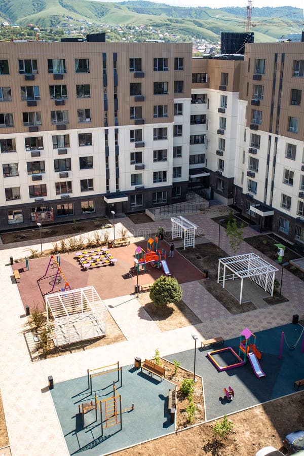 Top View of the Courtyard of a Multi-storey Building with a Playground ...