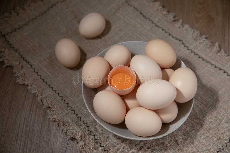 Top View of a Craked Egg on a Stack of Fresh Eggs on a Tablecloth Stock ...