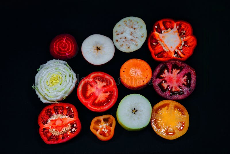 Top View of Cut in a Half Vegetables and Fruits Isolated a Black ...