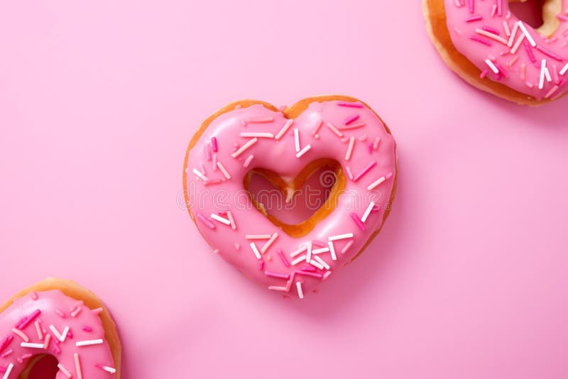 Top View of Cute Heart Shaped Pink Donuts with Sugar Sprinkles Stock ...