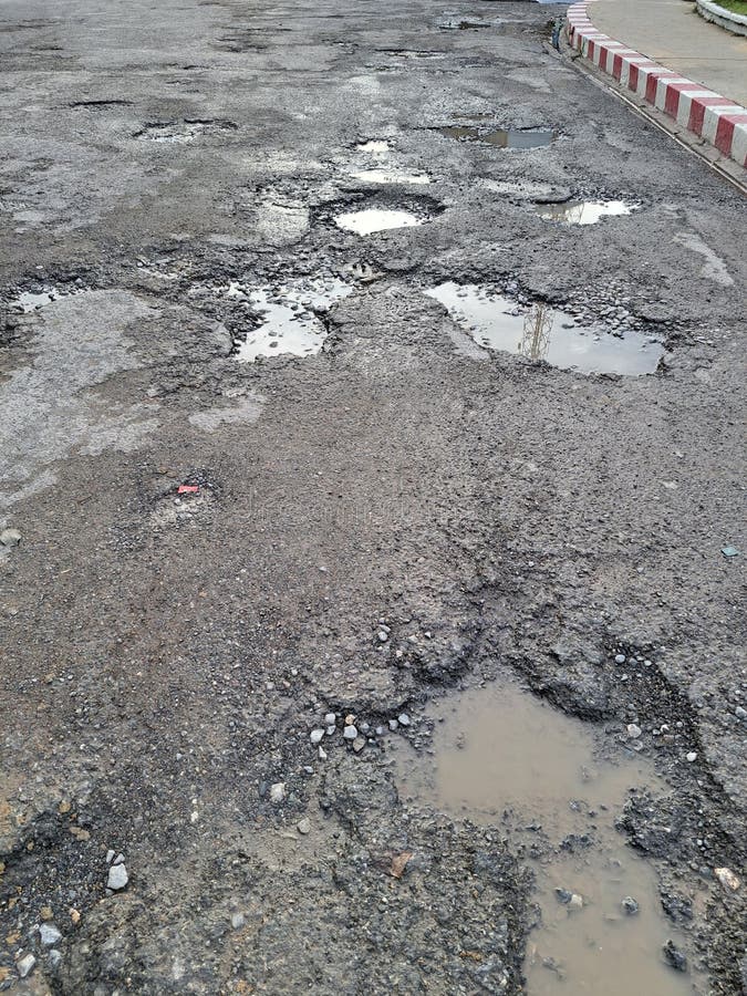 Top View of a Damaged Cement Paved Road with Waterlogging. Stock Image ...