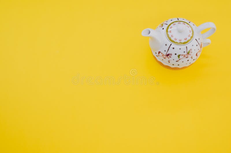 Top View of Decorative Teapot Isolated on Yellow Background Stock Photo ...