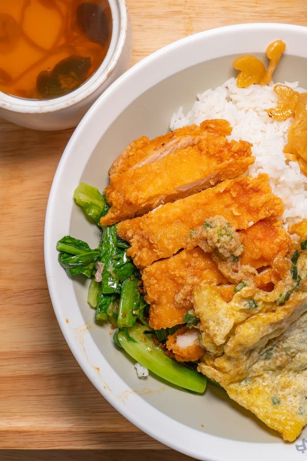 Top View Deep Fried Chicken Fillet and Fried Egg Rice with Pork Tripe ...