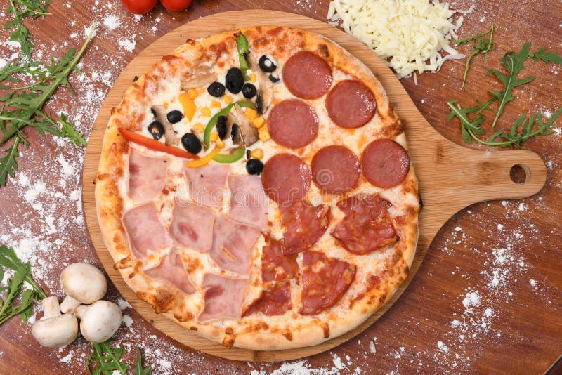Top View of a Delicious Pizza Divided into Four Parts with Different ...