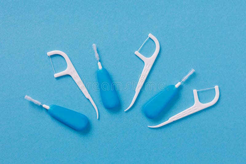 Top View of Dental Floss Picks on Blue Background Stock Image - Image ...