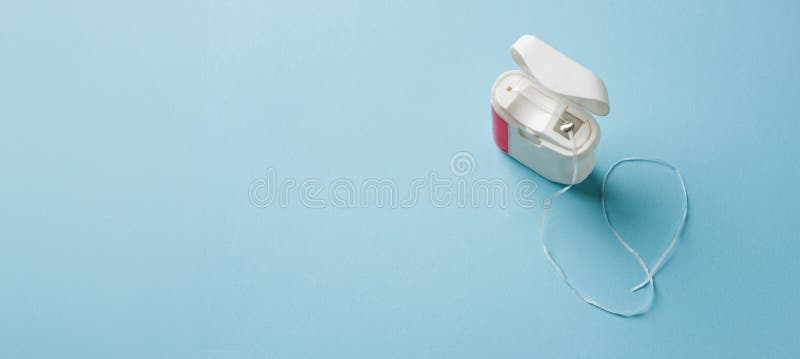 Top View of Dental Floss in White Box on Blue Background Stock Image ...