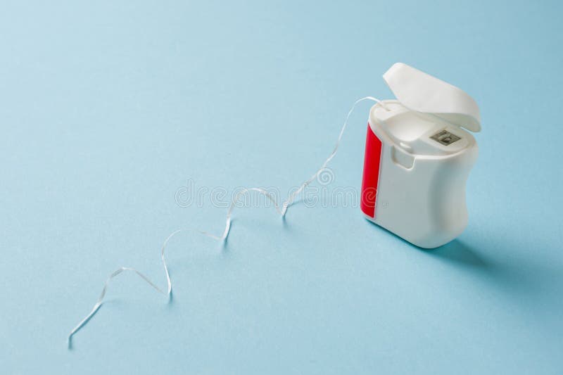 Top View of Dental Floss in White Box on Blue Background Stock Image ...