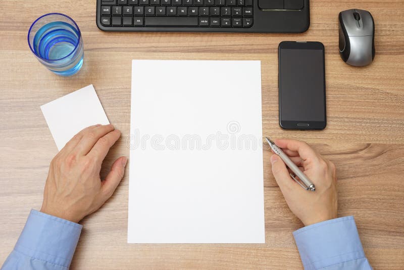 Top View Of Desk With Empty Paper And Man With Pen In Hand, Read Stock ...