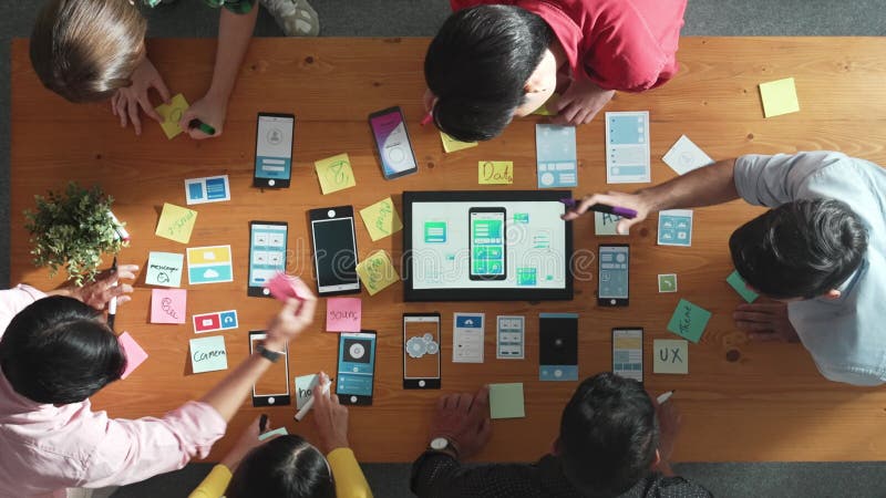 Top View of Developer Team Working Together To Write Idea on Note ...