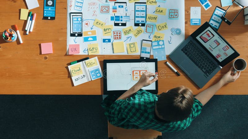 Top View of Developer Working on Tablet and Writing Ux Ui Design ...