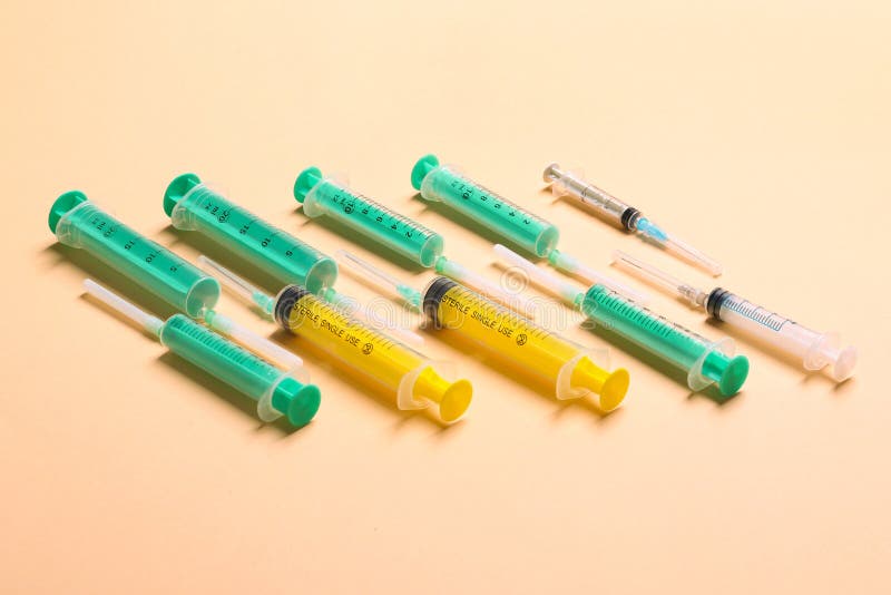 Top View of Different Syringes at Orange Background. Medical Injection ...
