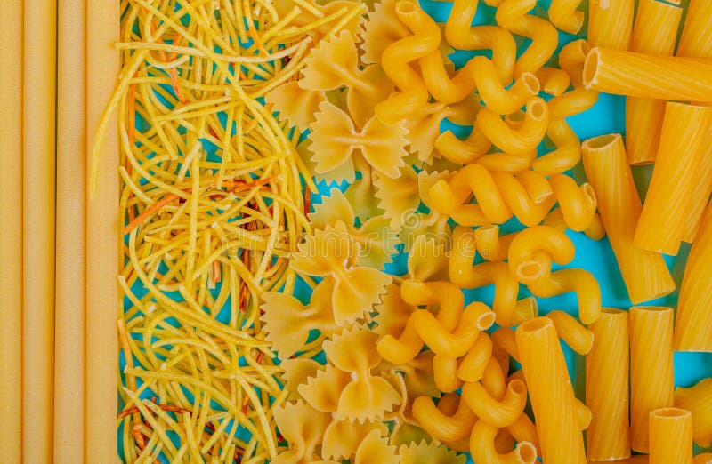 Top View of Different Types of Macaroni on Blue Background Stock Image ...