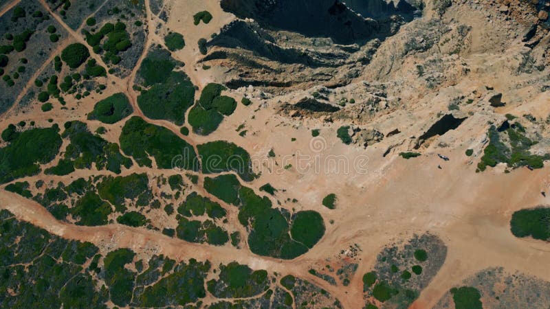 Top View Dirt Path Stretching Though Low Vegetation To Steep Cliff ...