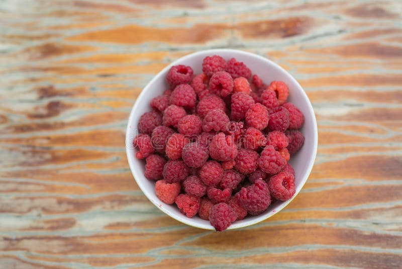 TOP VIEW: a Dish with a Raspberries on a Table Stock Photo - Image of ...