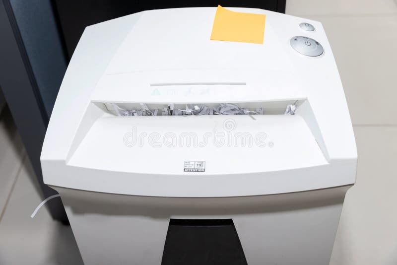 Top View of Document Shredder with Papers Overflowed from Inside the ...
