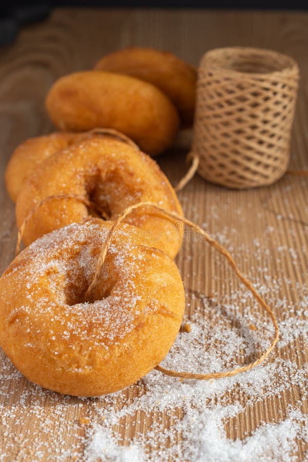 Top View of Donuts with Rope and Sugar Roll on Wooden Table Stock Image ...