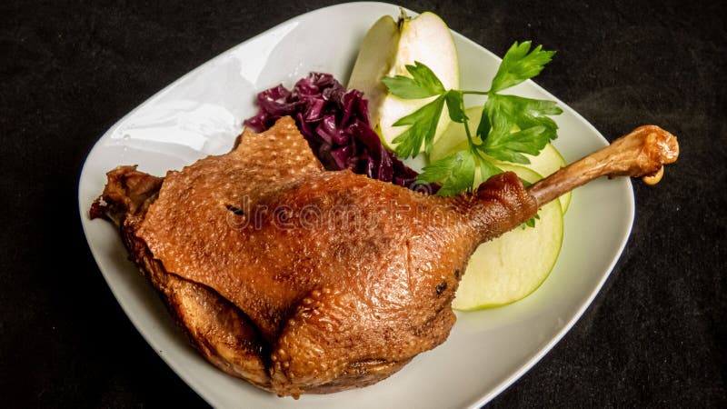 Top View of a Duck Leg Served with Apple, Cabbage and Parsley on a ...