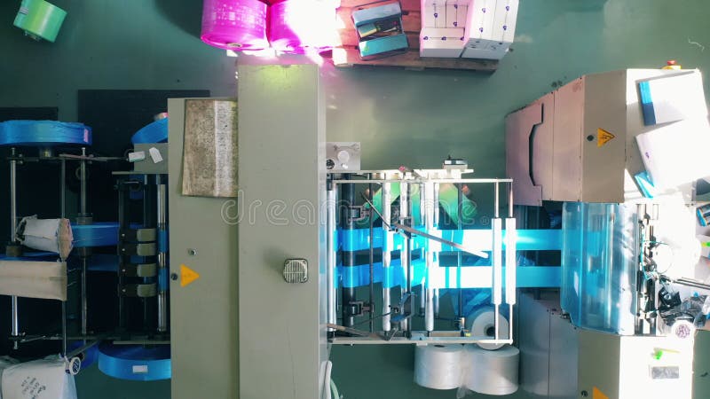 Top View of an Employee Working with a Plastic-producing Conveyor Stock ...