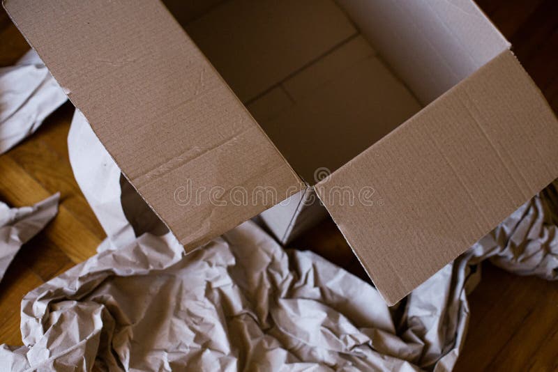 Top View of an Empty Box and Brown Wrapping Paper on the Floor Stock ...