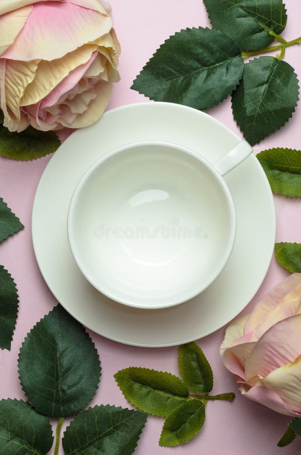 Top View of an Empty Teacup with Pink Roses and Leaves on a Pink ...