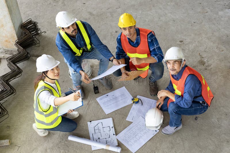 Top View of Engineer, Architect, Contractor and Foreman Meeting at the ...