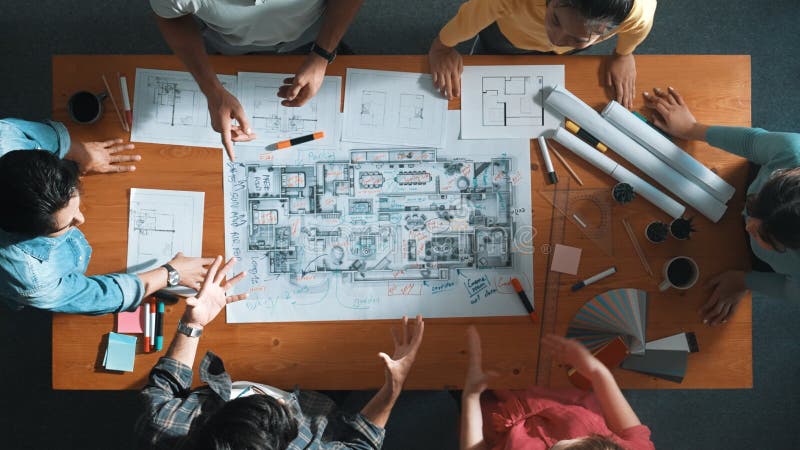 Top View of Engineer Team Holding Blueprint and Standing at Table ...