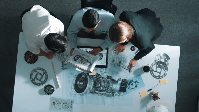 Top View of Engineer Working Together while Looking at Jet Engine ...
