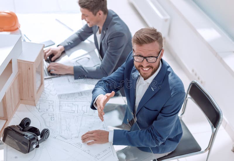 Top View. Experienced Architect Extending His Hand for a Handshake ...