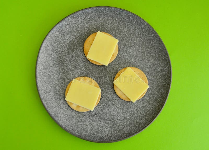 A Top View of Extra Tasty Cheddar Cheese on Cracker Biscuits. Stock ...