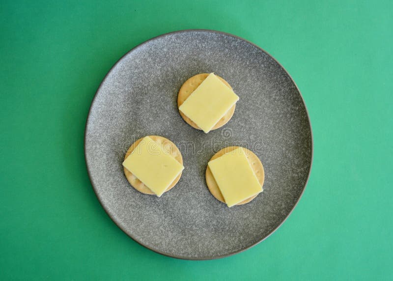A Top View of Extra Tasty Cheddar Cheese on Cracker Biscuits. Stock ...