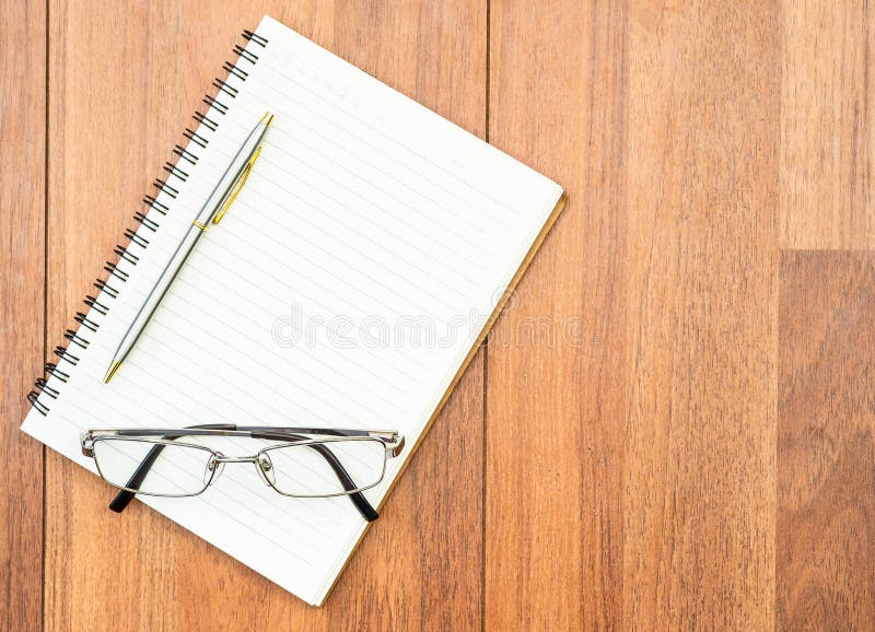 Eyeglasse and Notepad on Wood Deck with Copyspace Stock Image - Image ...