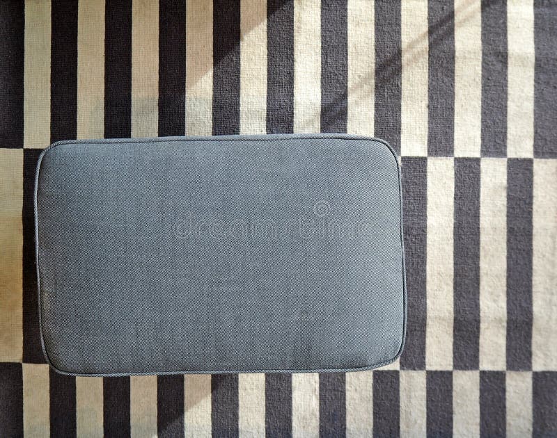 Top View of Fabric Blue Rectangular Pouf on Blue and White Striped ...