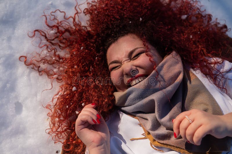 Top View of a Fat Red-haired Woman Lying on the Snow. Stock Image ...