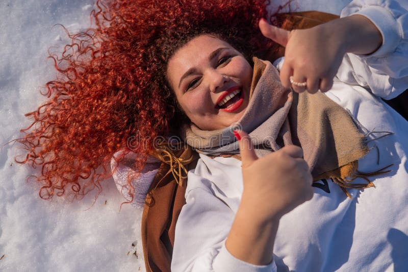 Top View of a Fat Red-haired Woman Lying on the Snow. Stock Image ...