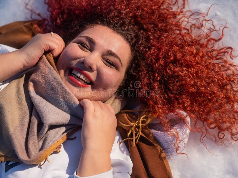 Top View of a Fat Red-haired Woman Lying on the Snow. Stock Image ...