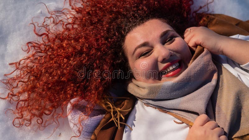 Top View of a Fat Red-haired Woman Lying on the Snow. Stock Image ...
